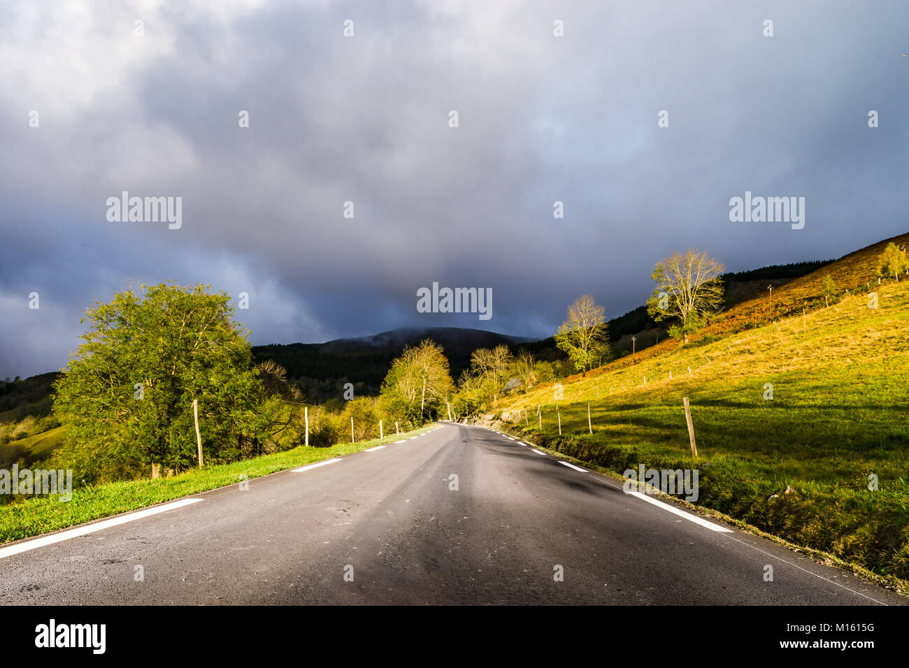 Beautiful empty road in Pyrenees. Autumn sunrise, shadows and colors of ...