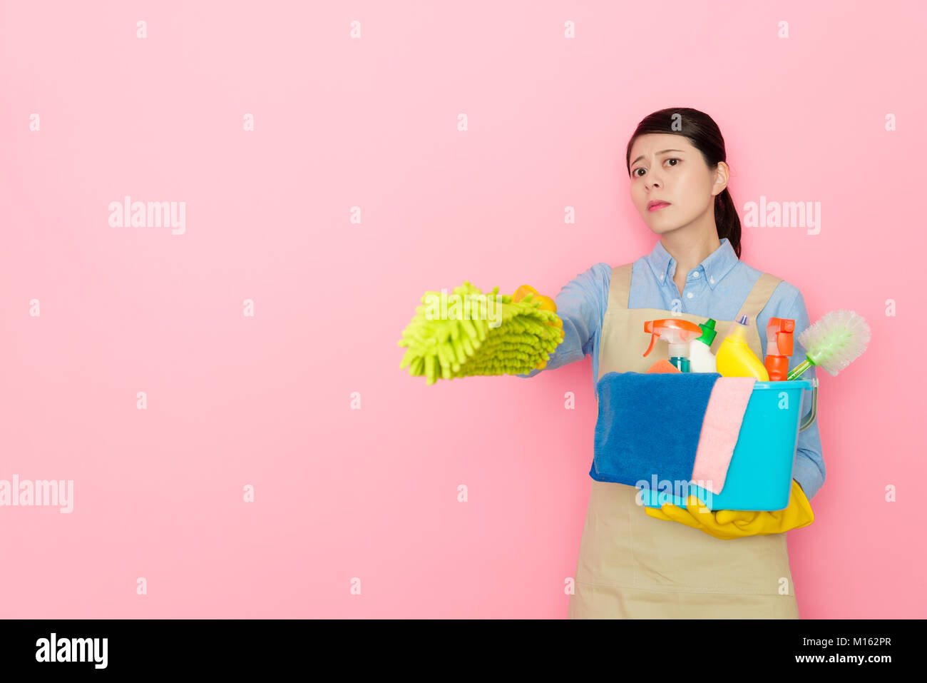 Girl with feather duster hi-res stock photography and images - Alamy
