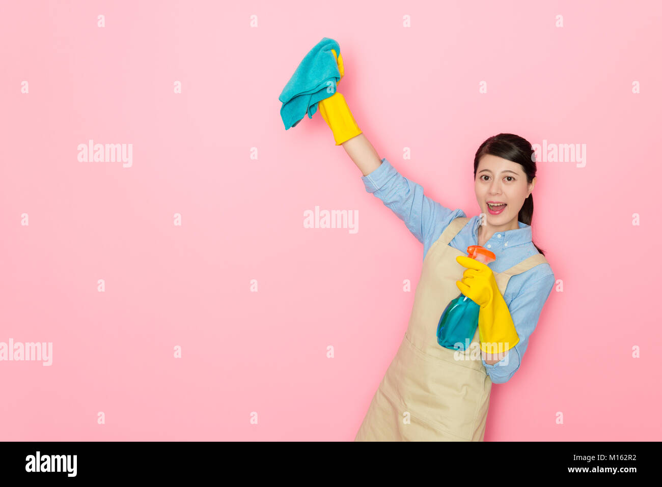 cheerful elegant housewife celebrating finished housekeeping isolated ...
