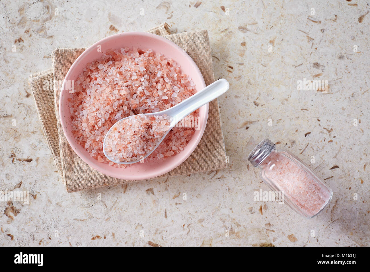 Pink Himalayan salt in the small pink bowl on marble surface Stock ...