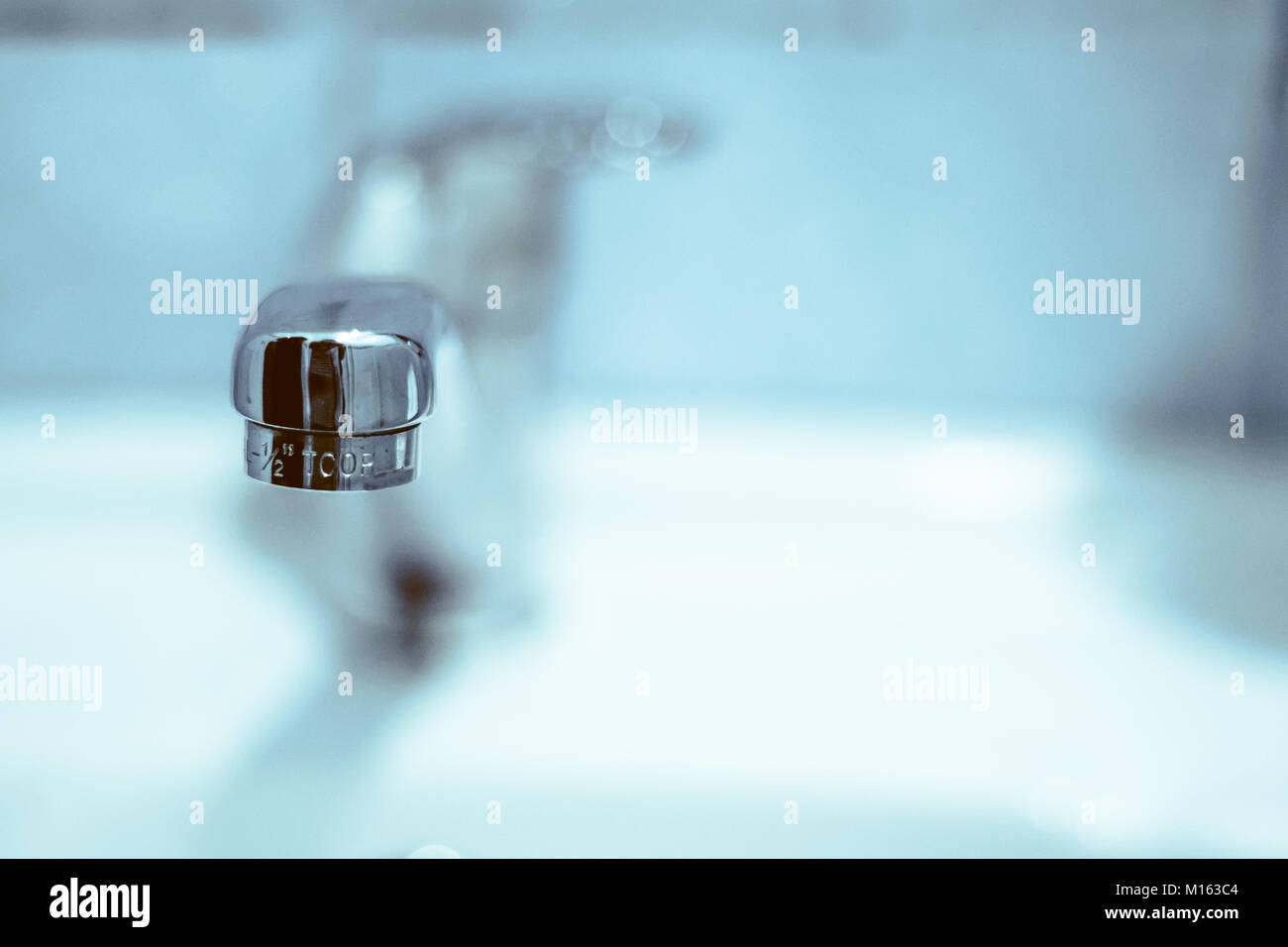 the faucet in the sink tip closeup Stock Photo - Alamy