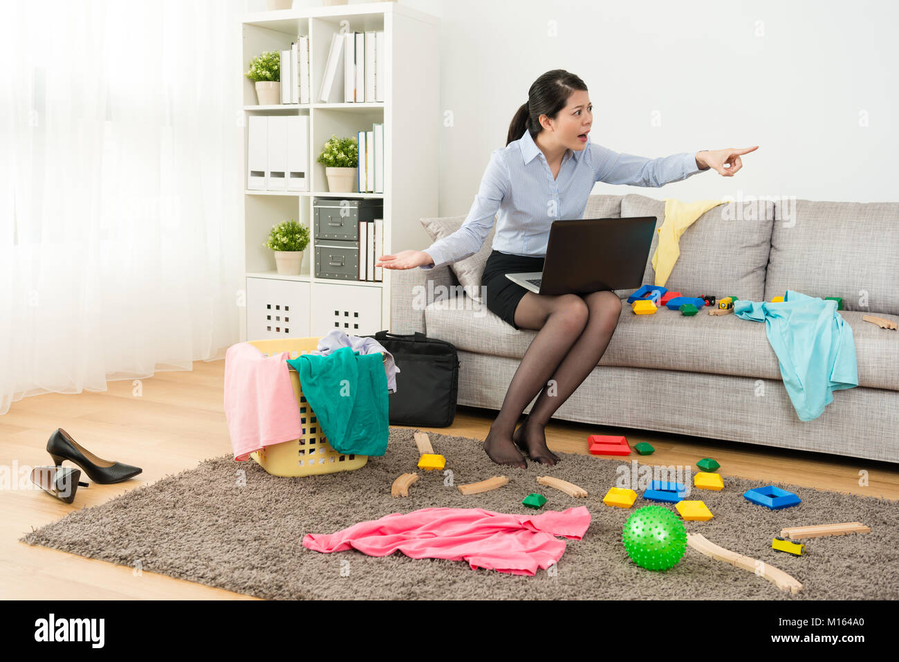 young beautiful female office manager back to home finding mess living ...