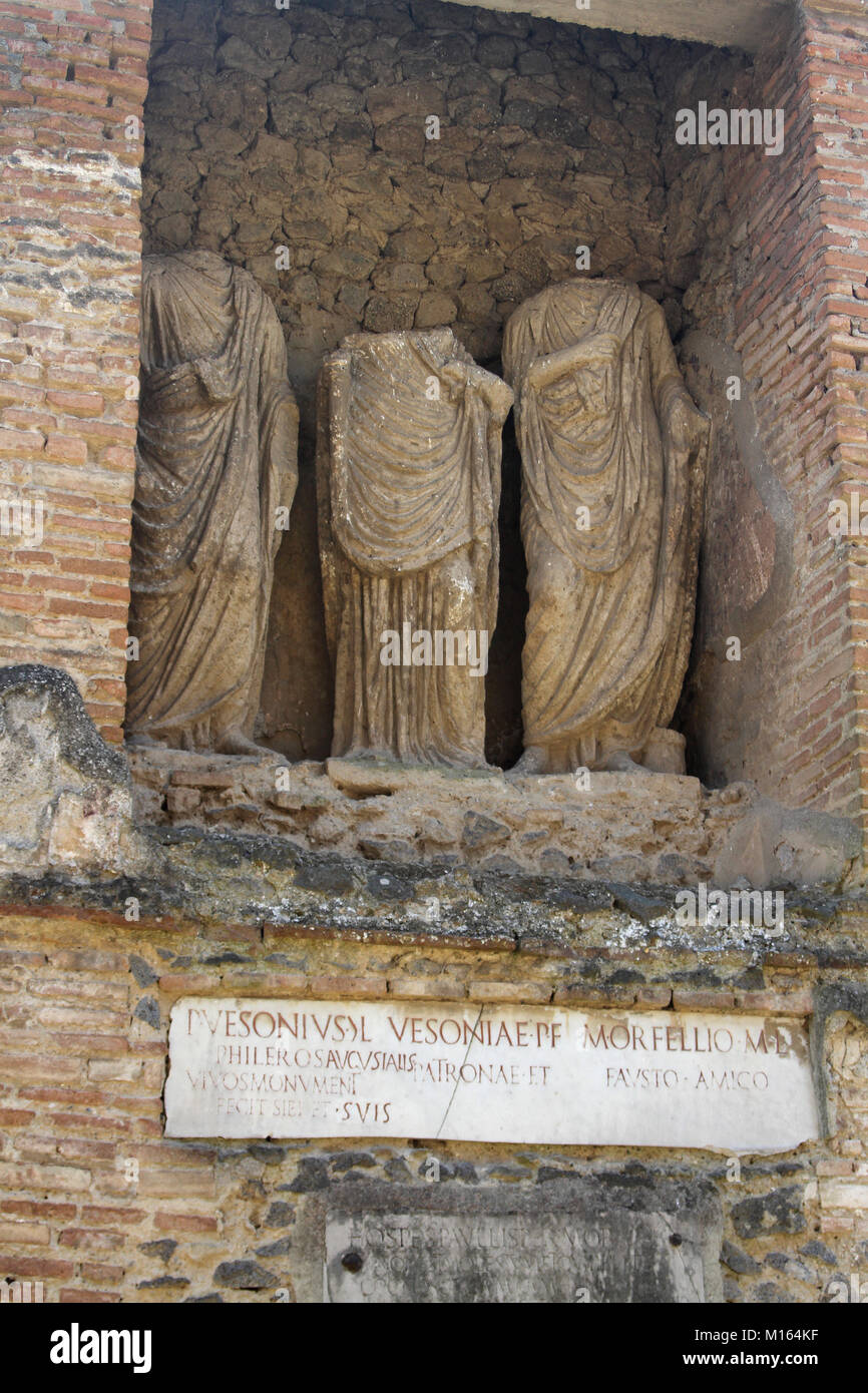 23OS. Three headless statues, Publius Vesonius Phileros I, to the left ...