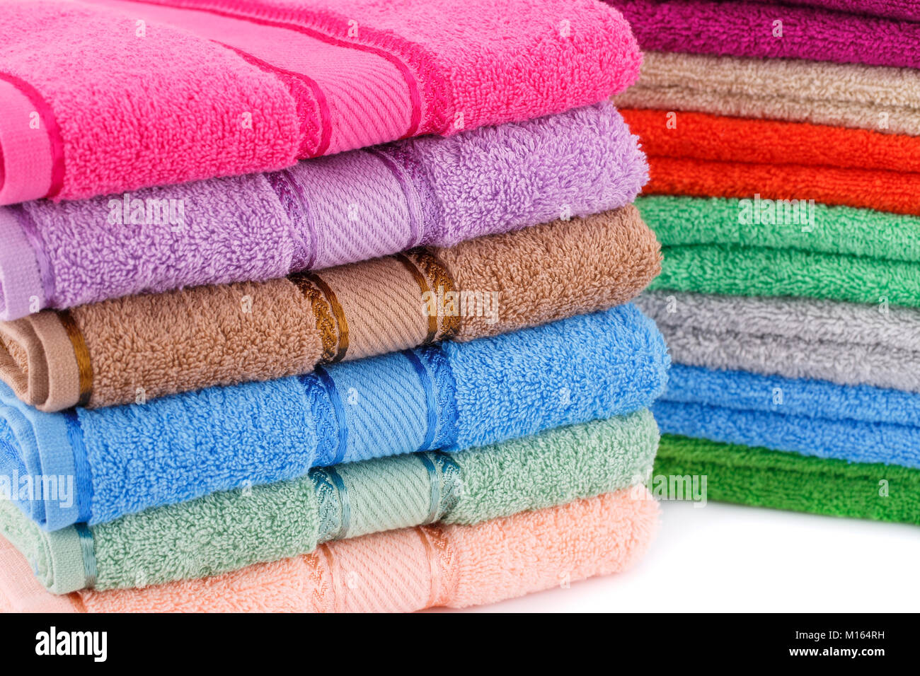 Colorful towels stacks closeup picture Stock Photo - Alamy