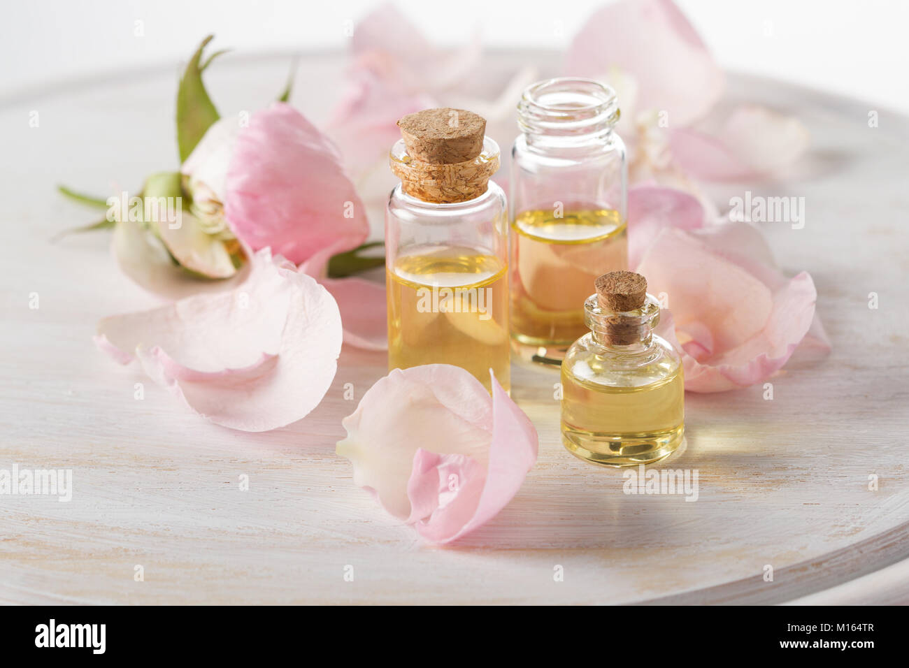 Roses aroma oil for aromatherapy,pink roses petals Stock Photo - Alamy