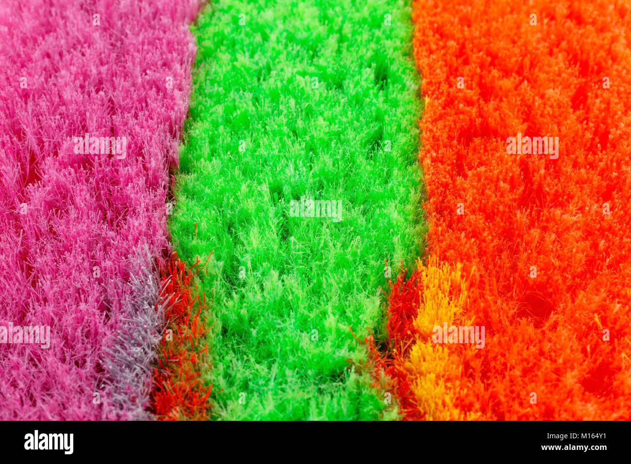 Colorful brooms closeup picture Stock Photo - Alamy