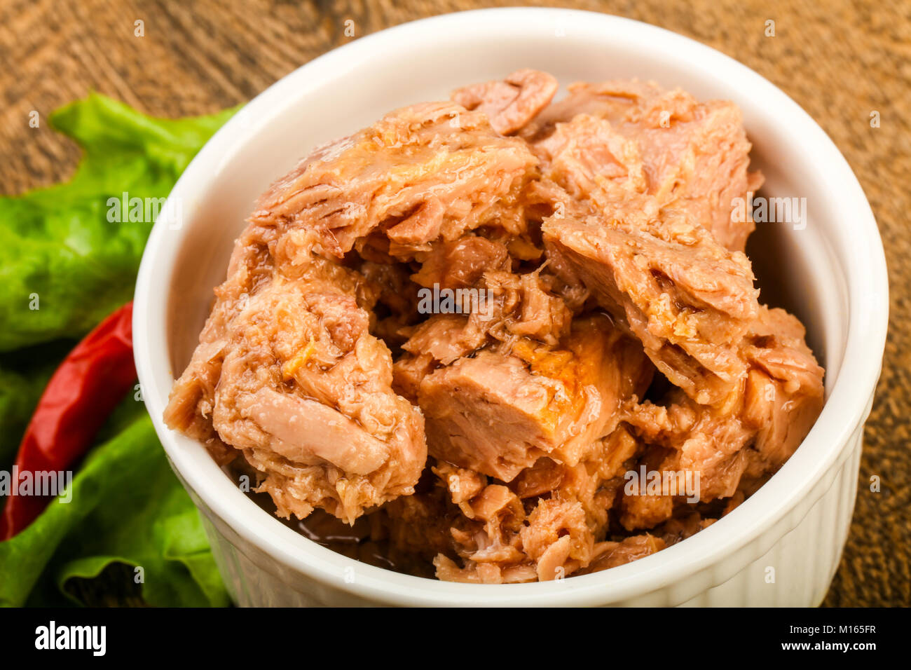 Canned tuna fish in the bowl ready for cooking Stock Photo - Alamy