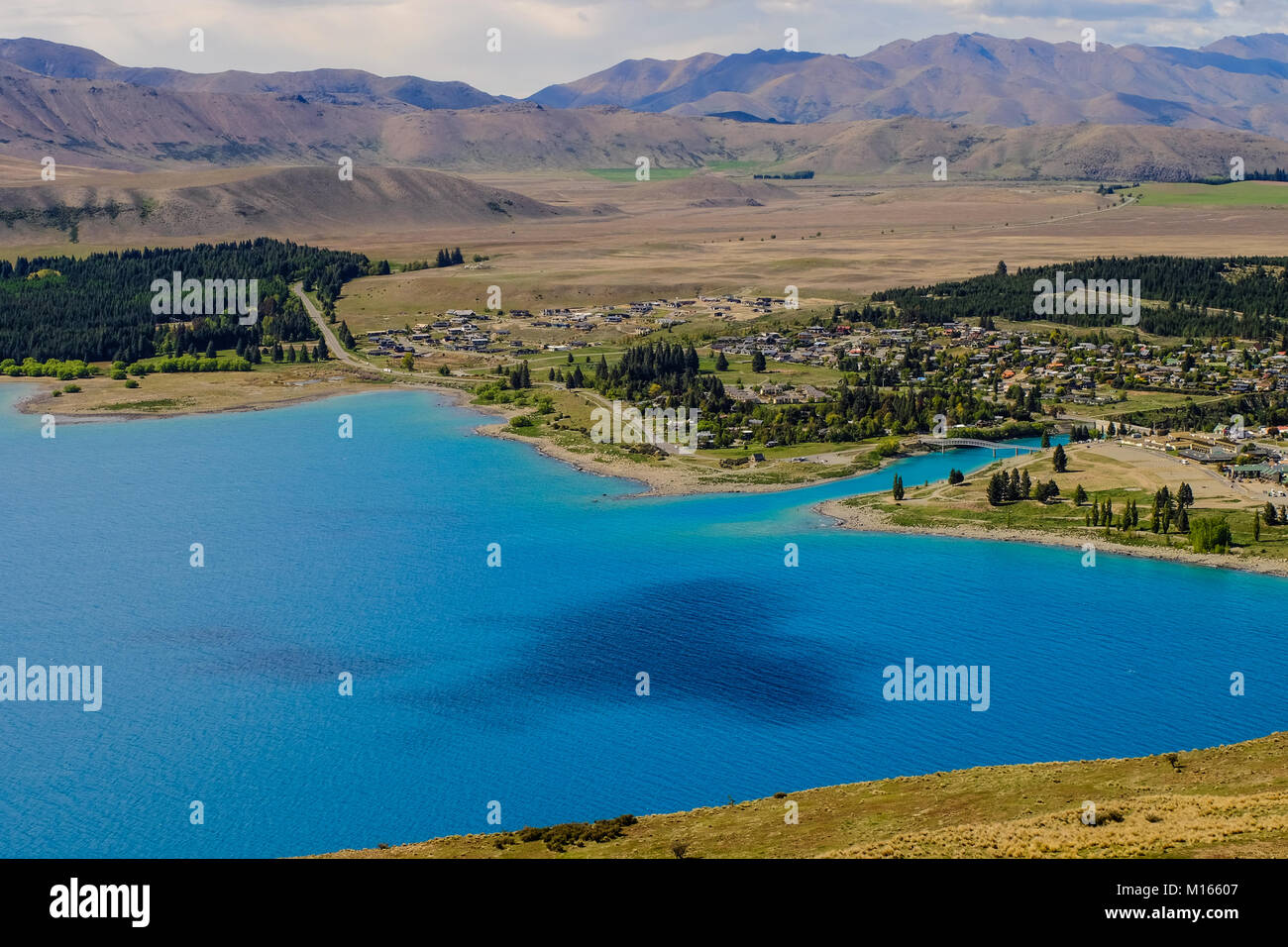 Lake Manapouri with small town in South Island, New Zealand Stock Photo ...