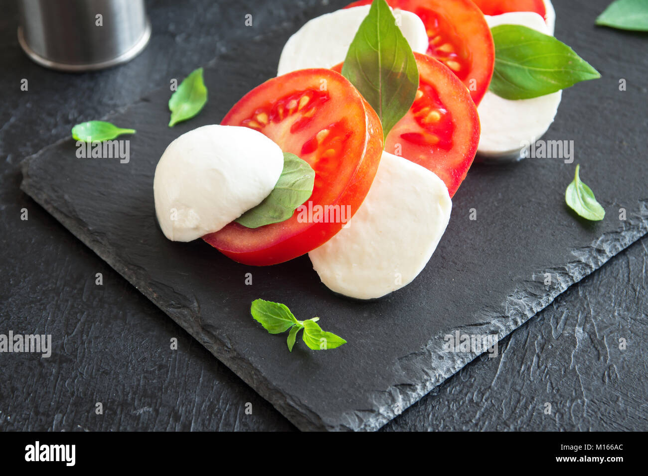 Traditional Italian Caprese Salad - sliced tomatoes, mozzarella cheese ...
