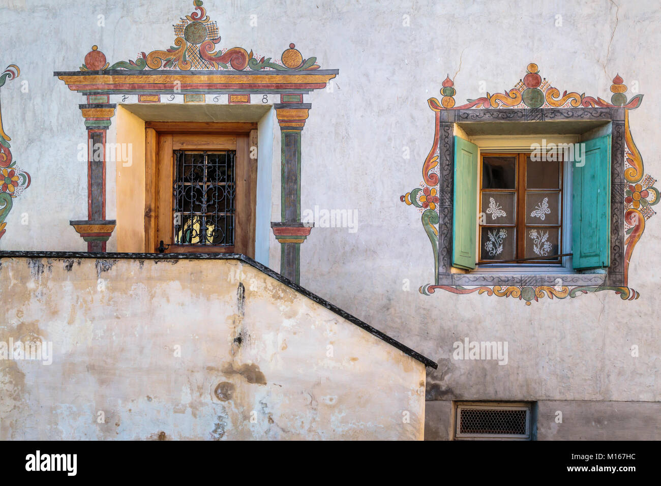 Ornate window designs in the village of Fuldera, Switzerland, Europe ...