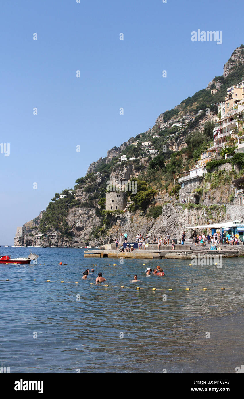 Beach and pier with shark net at Positano village, Amalfi Coast ...