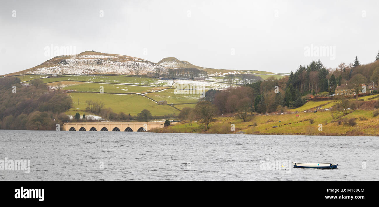 An image of a road bridge crossing over Ladybower Reservoir, with snow ...