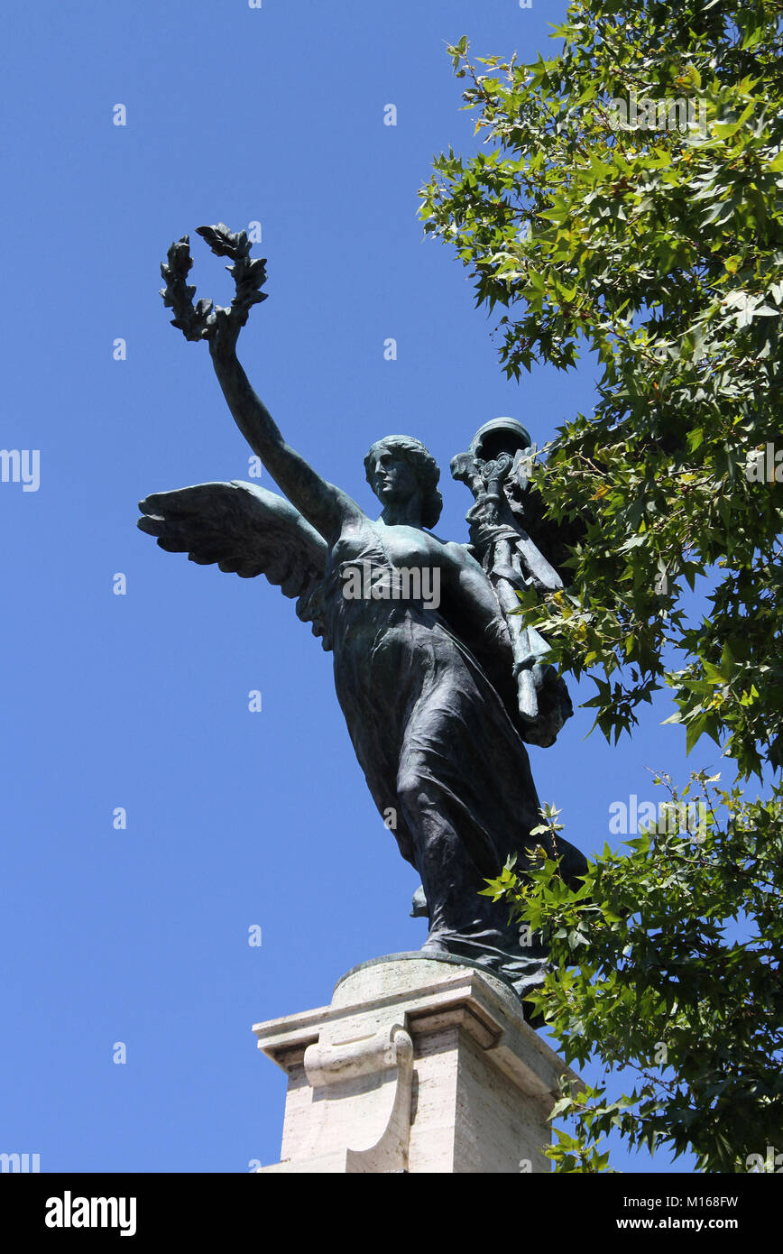 Bronze angel statue holding a laurel wreath at the Altare della Patria ...