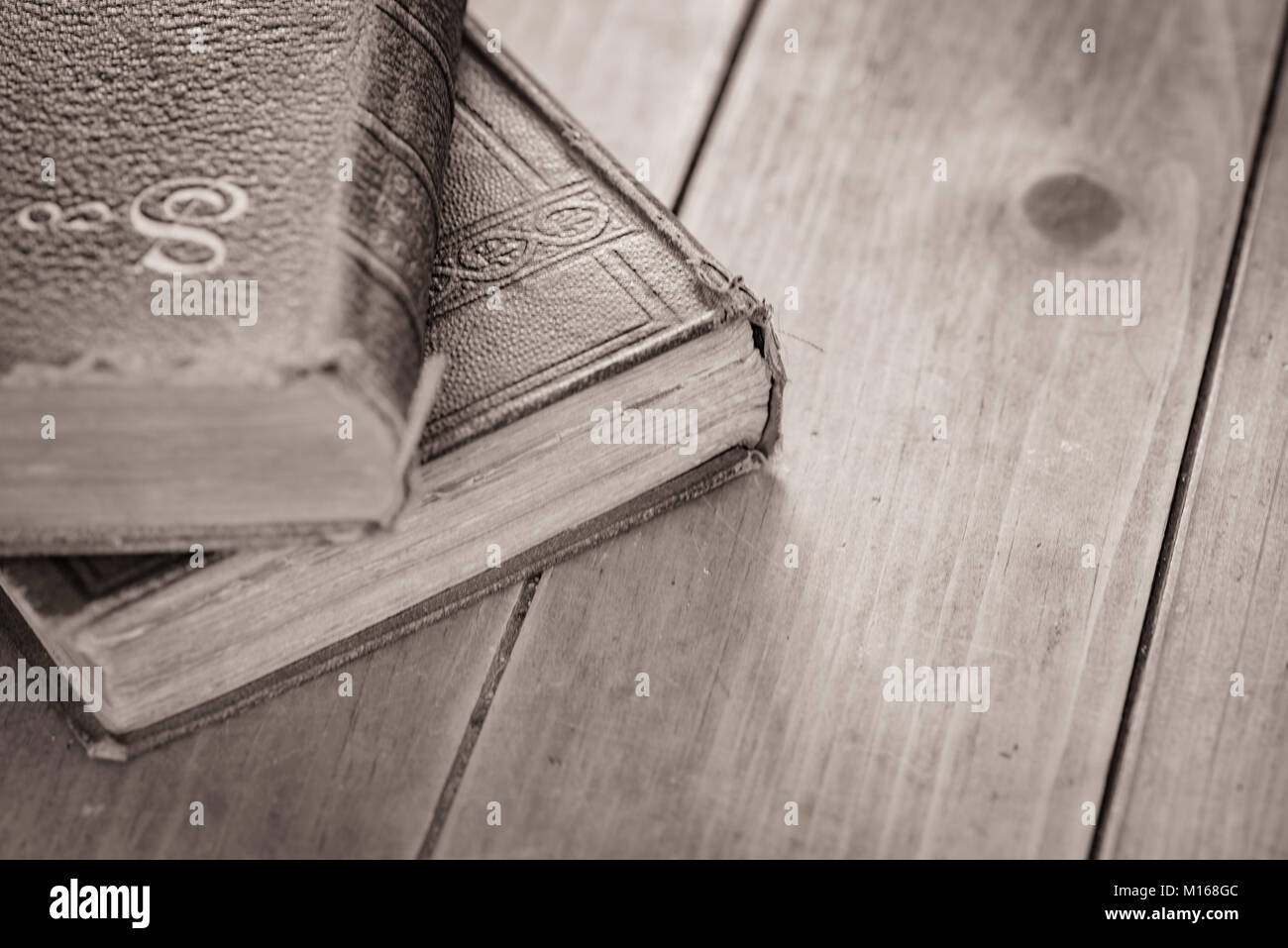 Ancient book on solid oak table Stock Photo - Alamy
