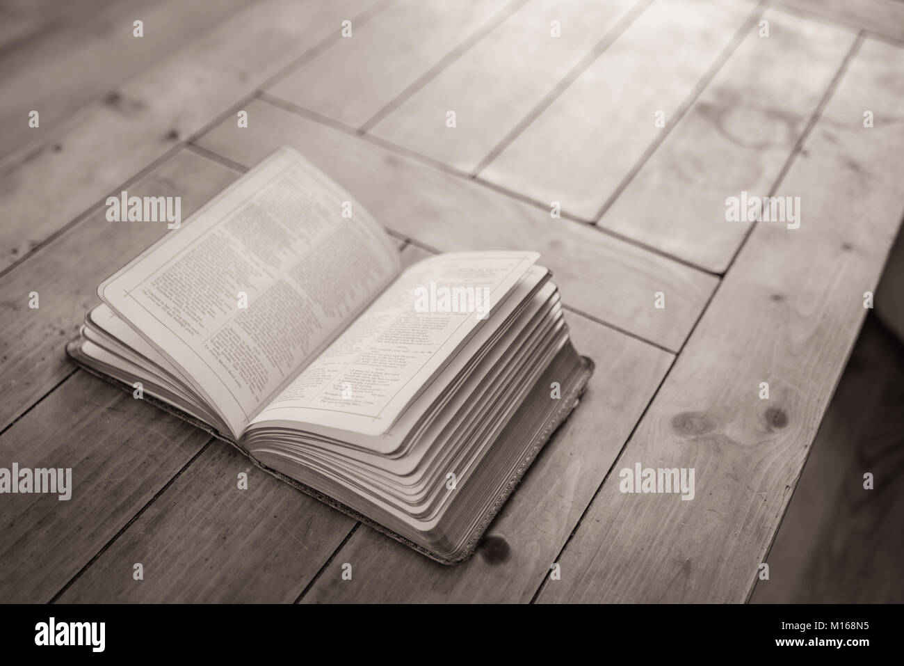 Ancient book on solid oak table Stock Photo - Alamy