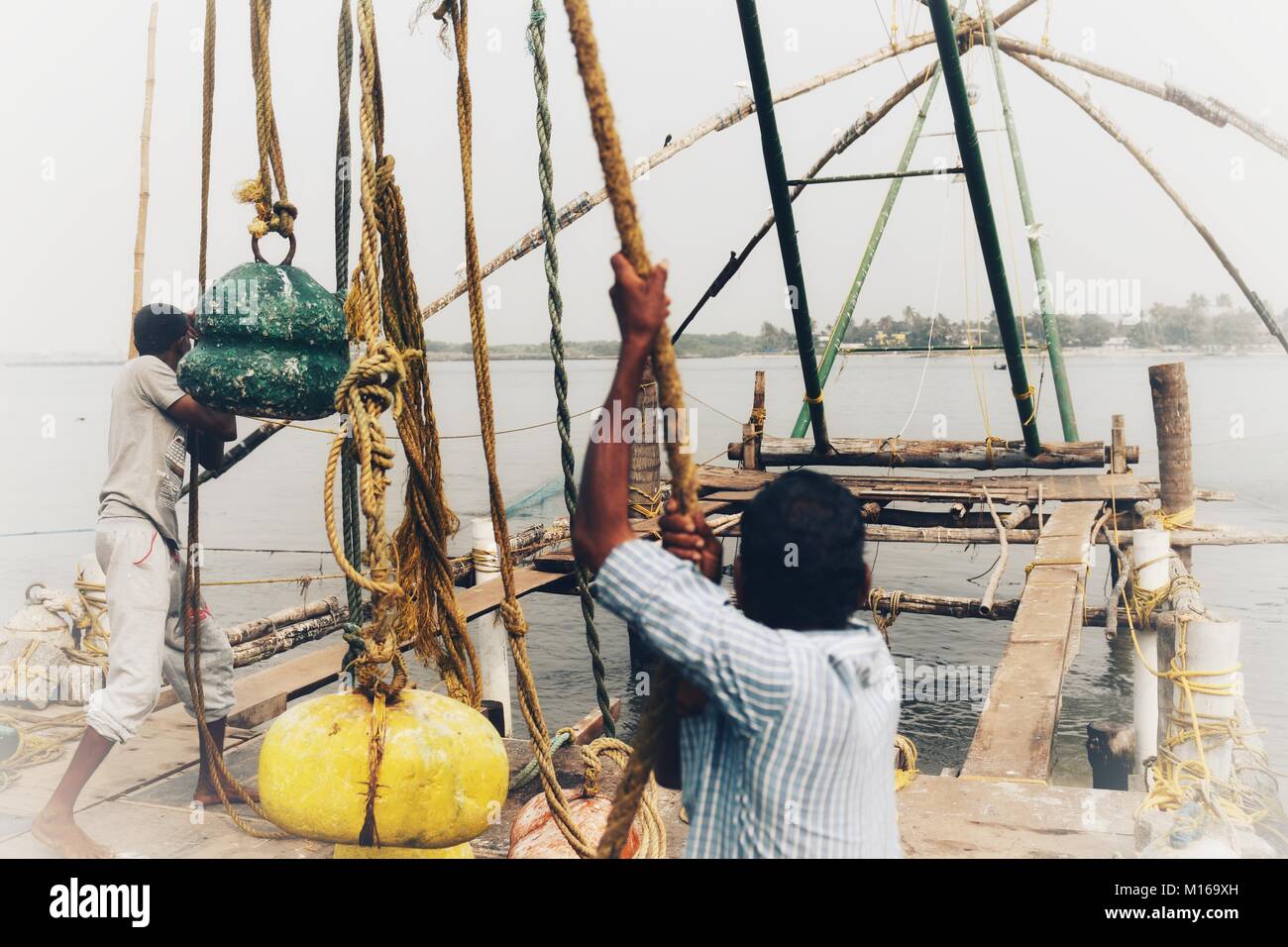 Pulling in fishing nets hi-res stock photography and images - Alamy