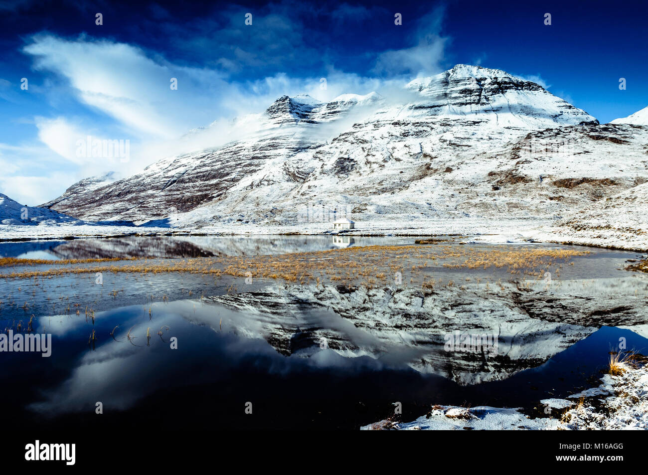 Liathach (The Grey One), wreathed in dramatic clouds and covered in ...