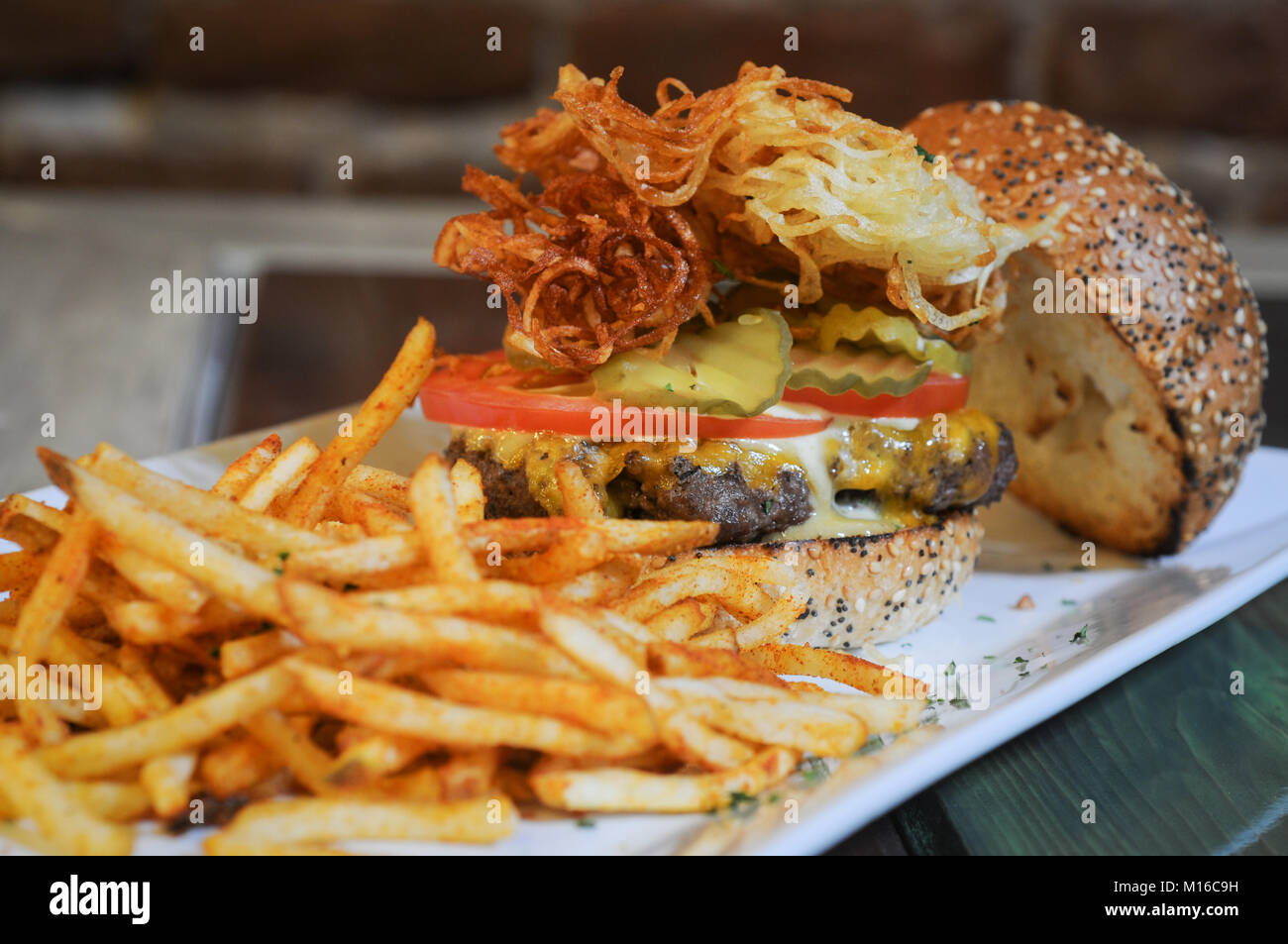Cheeseburger with French Fries Stock Photo - Alamy