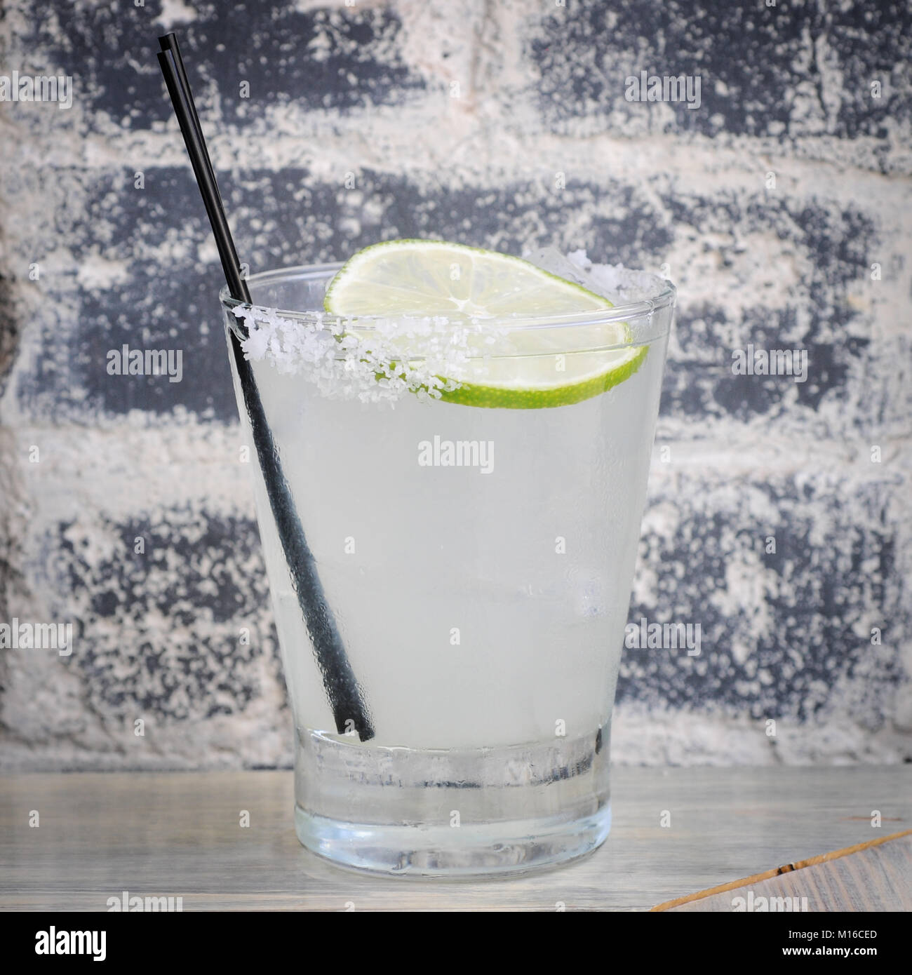Clear vodka cocktails with lemon Stock Photo - Alamy