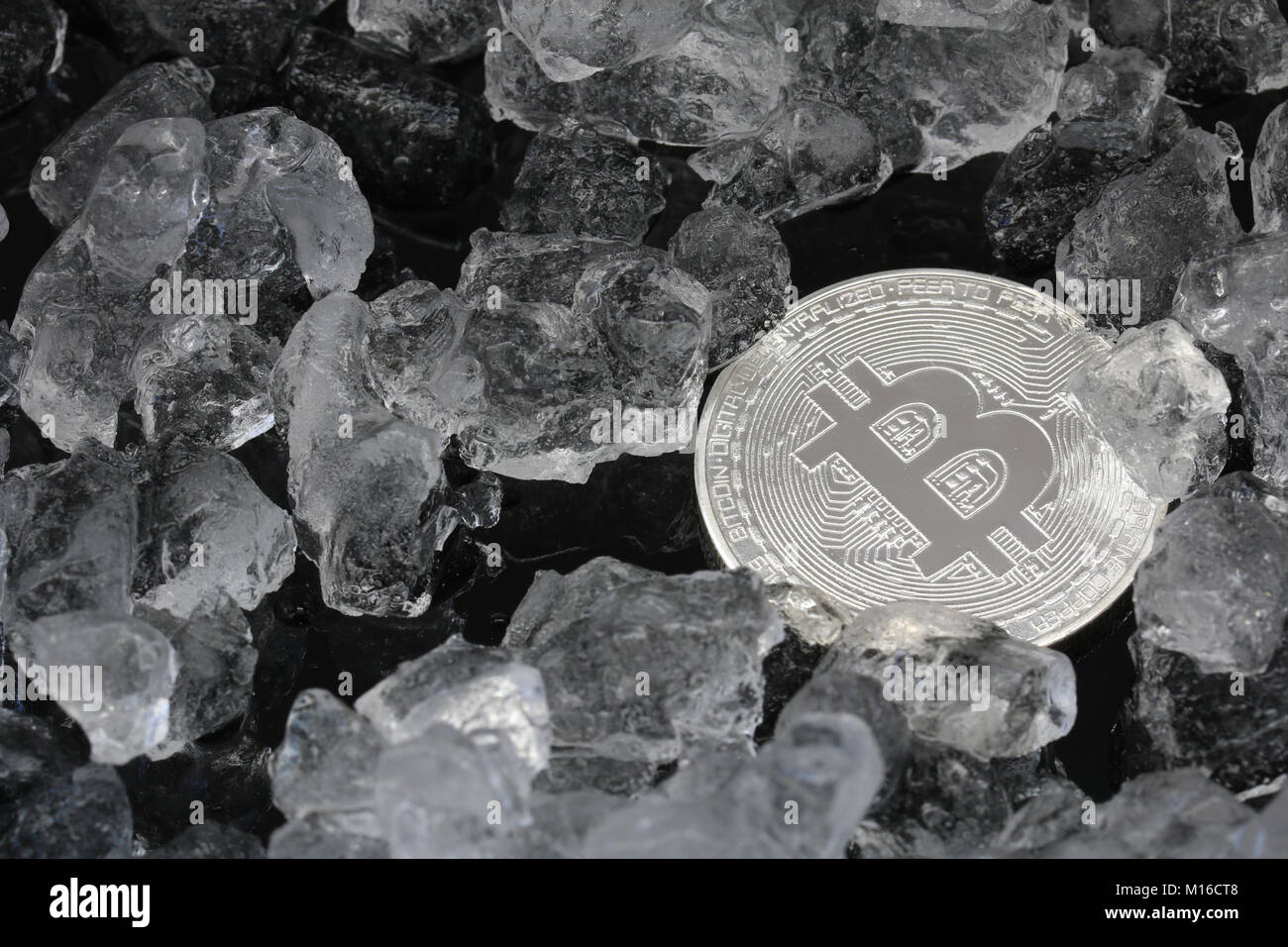 bitcoin on crushed ice background Stock Photo - Alamy