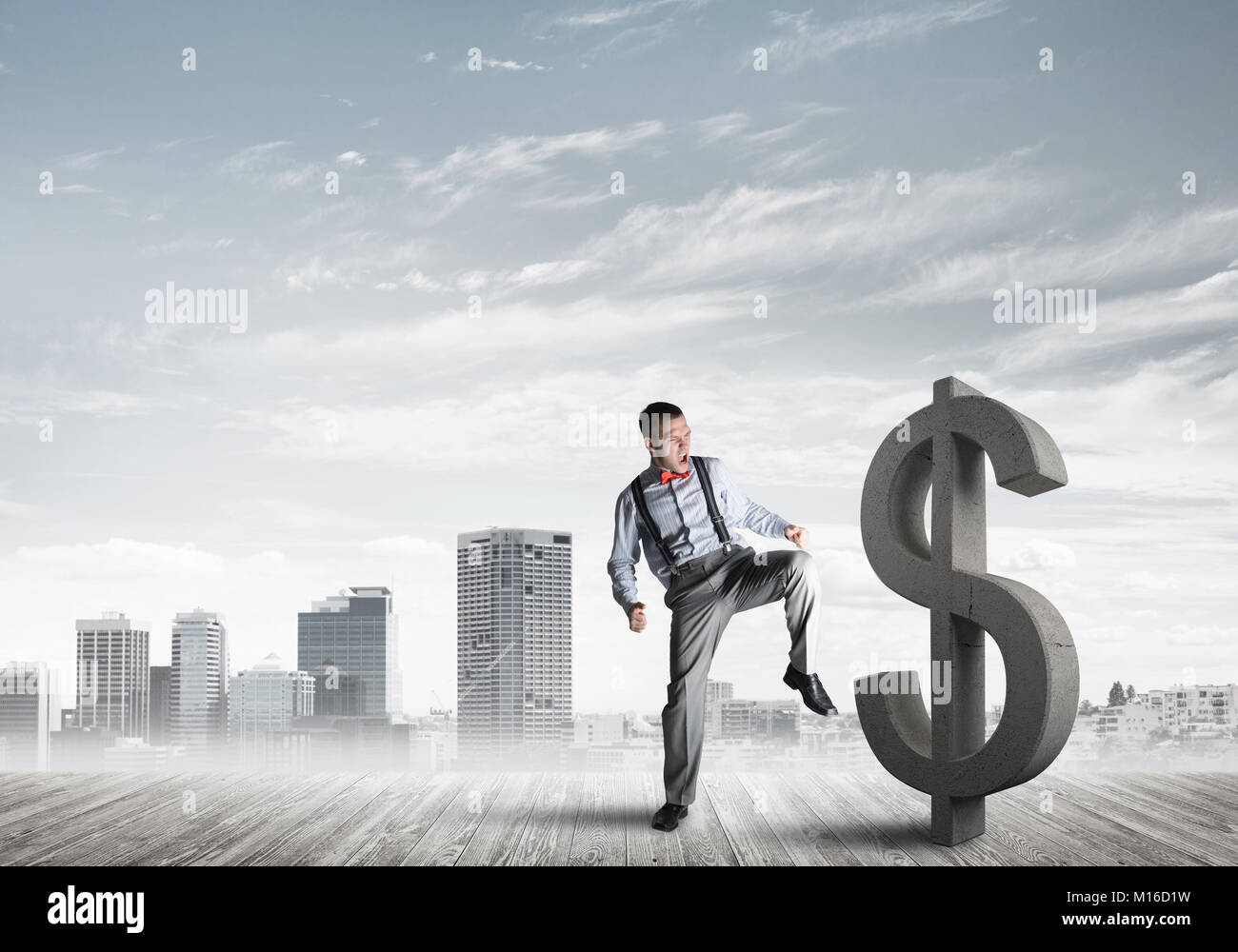 Determined banker man against modern cityscape breaking dollar cement ...