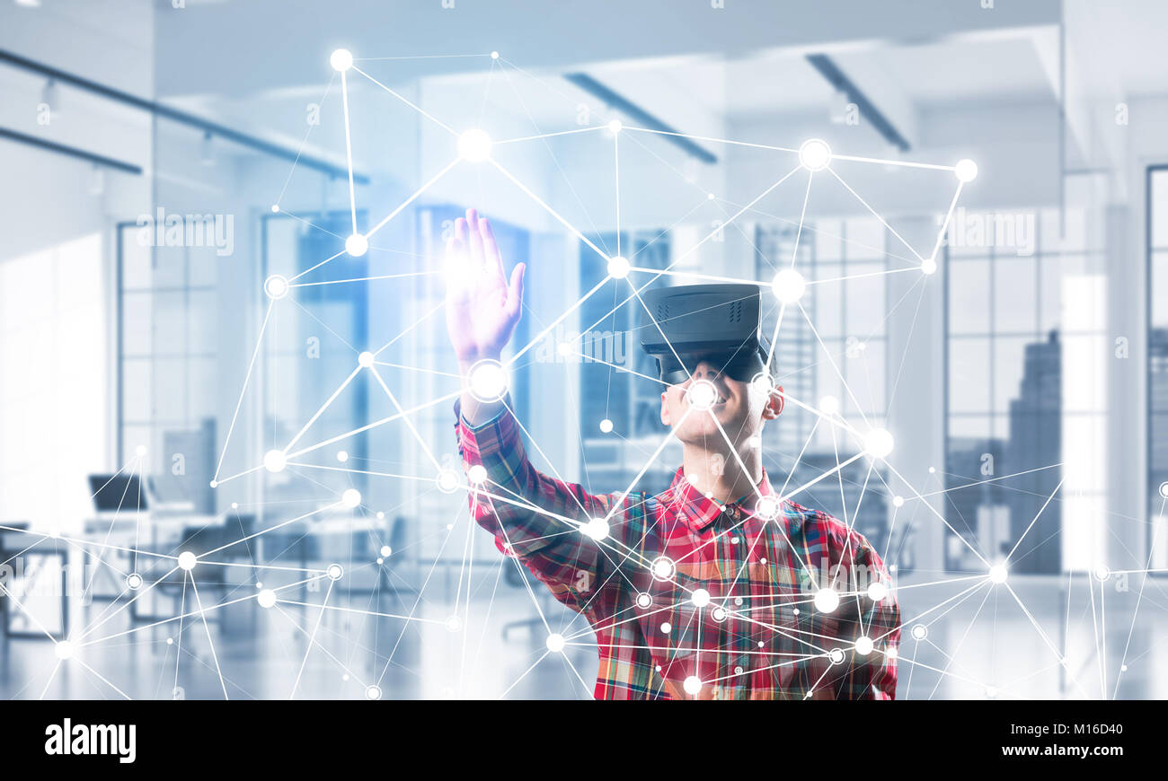 Guy wearing checked shirt and virtual mask reaching hand to touch ...