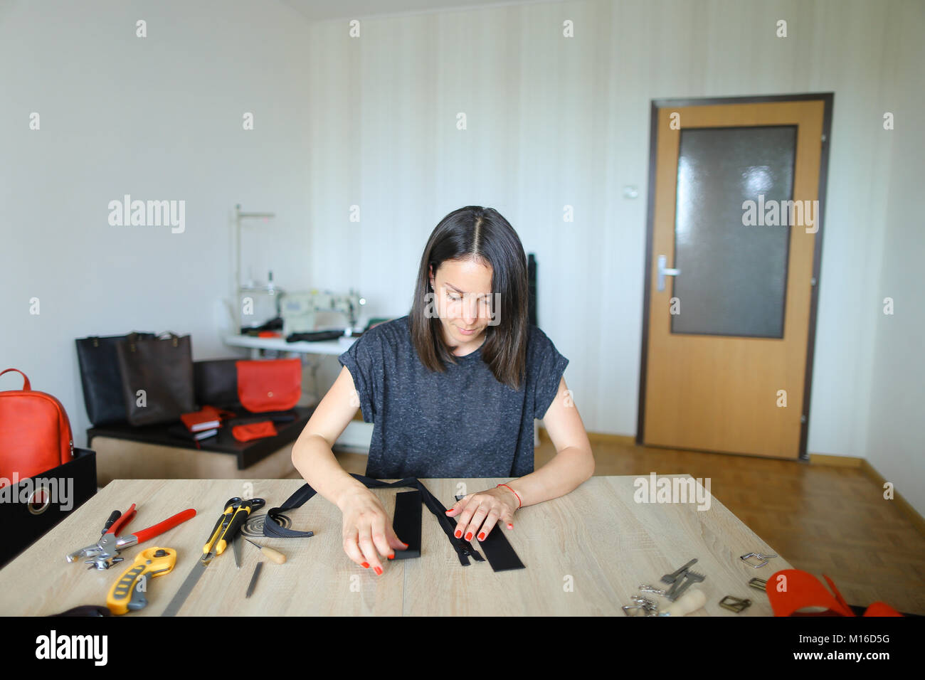 young designer making women bags for sale Stock Photo - Alamy