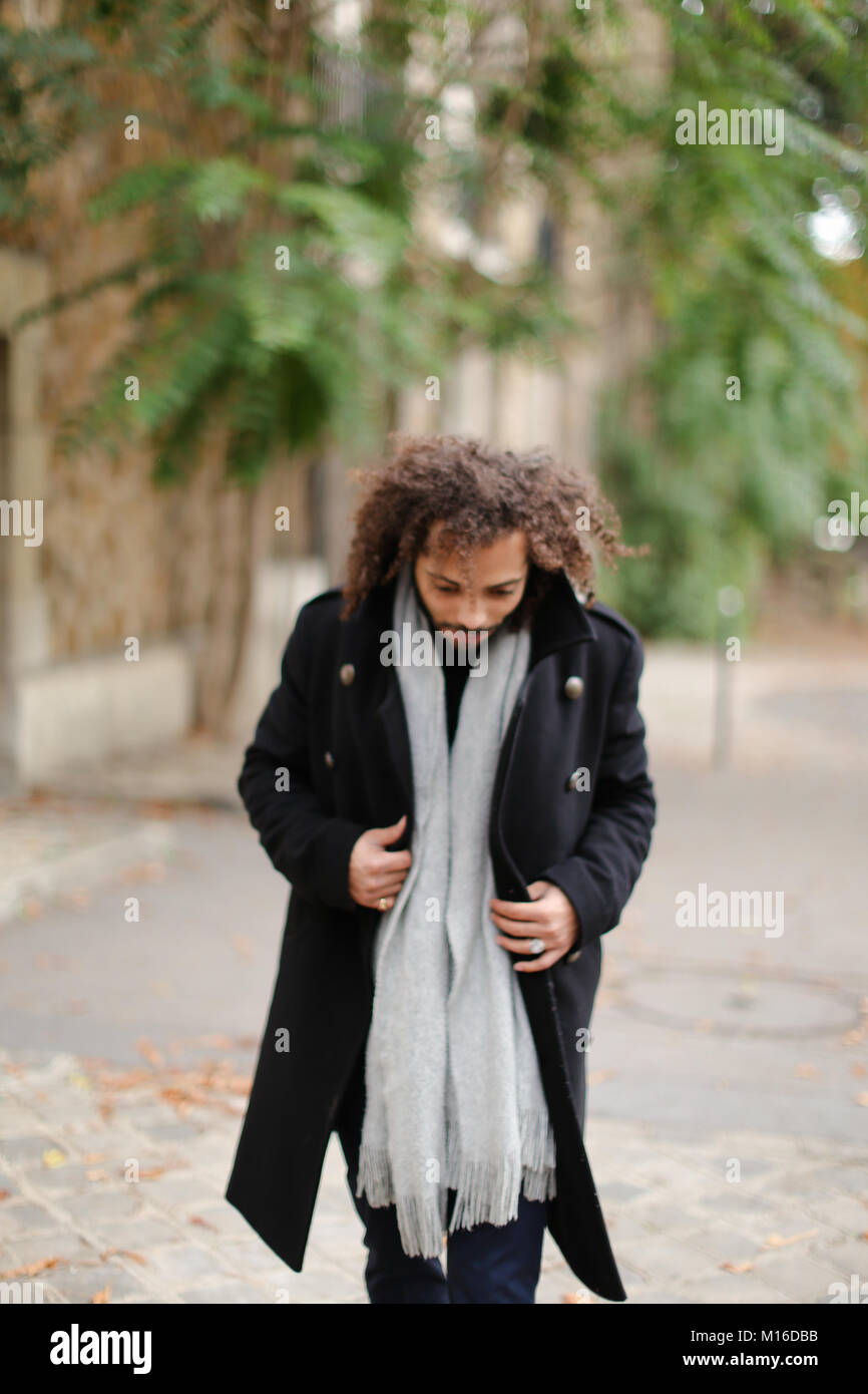 Young mix blood male person walking outside Stock Photo - Alamy