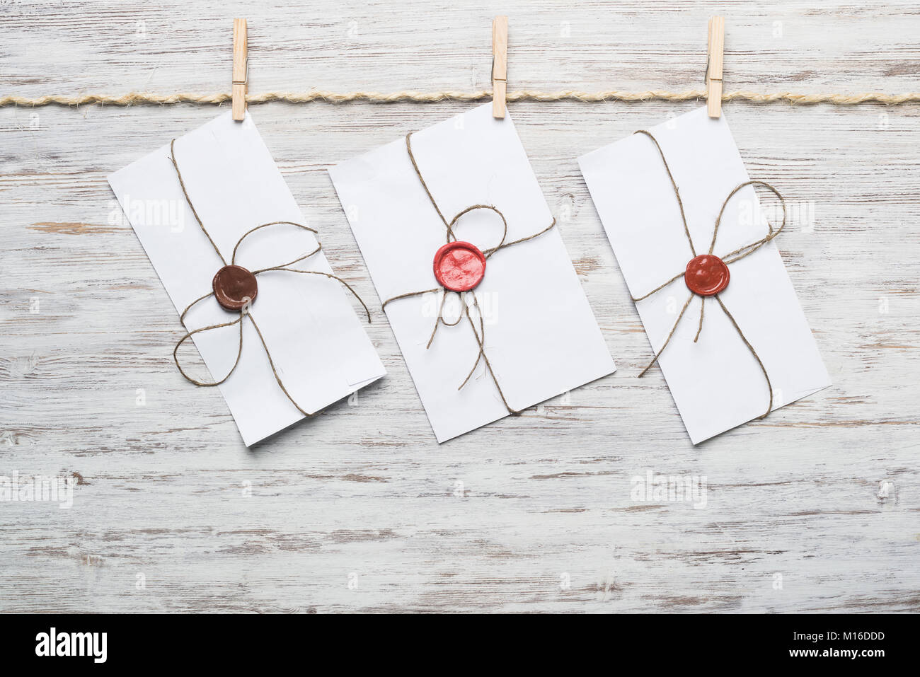 Mail envelope on rope Stock Photo - Alamy