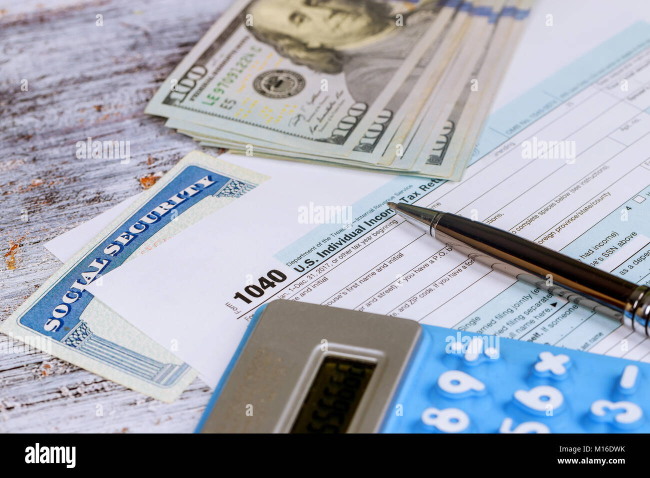 Calculating numbers for income tax return with calculator pay tax Stock ...