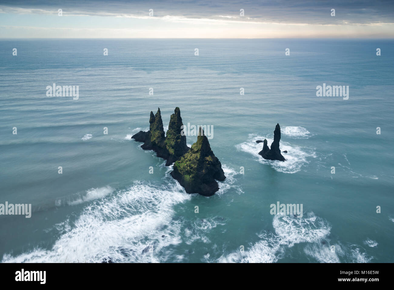 Reynisdranger basalt sea stack columns in the Atlantic Ocean, Iceland ...