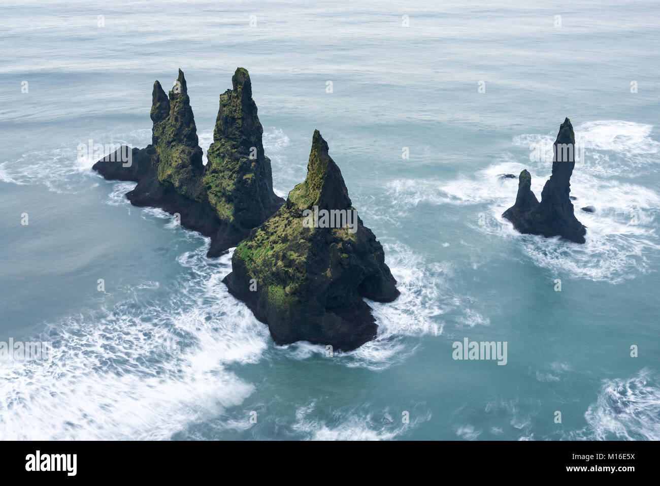 Reynisdranger basalt sea stack columns in the Atlantic Ocean, Iceland ...