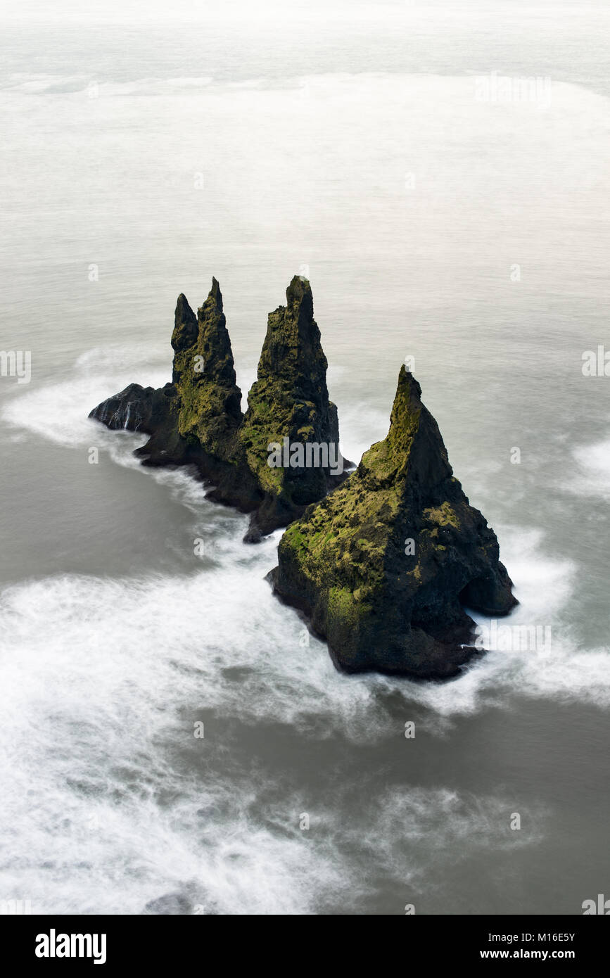 Reynisdranger basalt sea stack columns in the Atlantic Ocean, Iceland ...