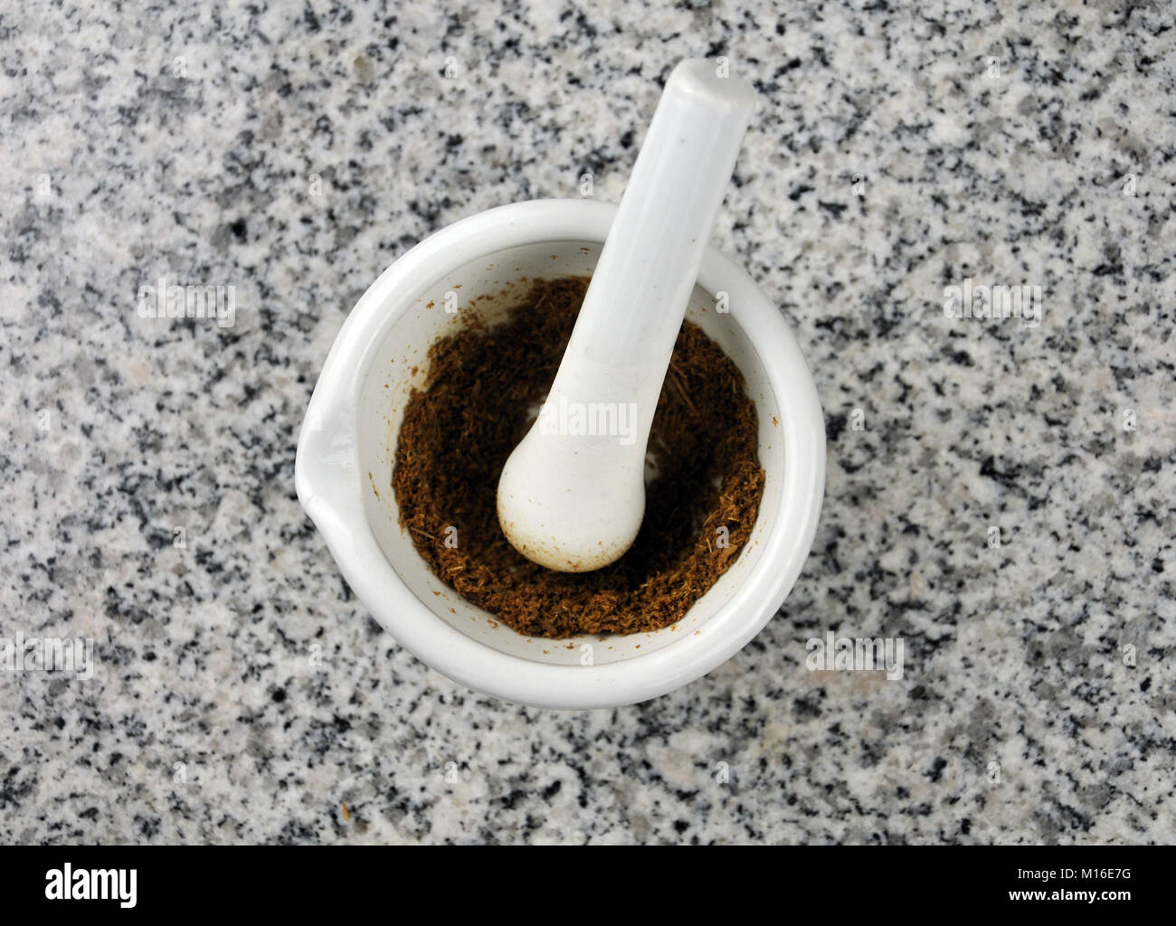 pestled cumin in mortar Stock Photo - Alamy