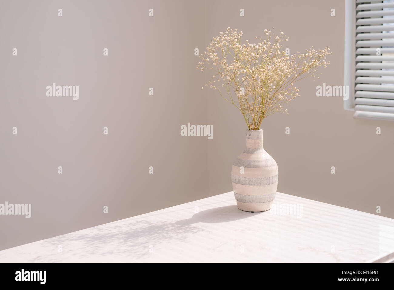 Beautiful spring flowers in vase on window background Stock Photo - Alamy