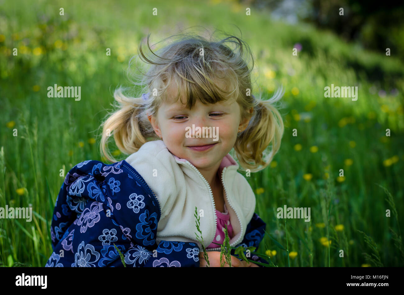 blond girl in spring park Stock Photo - Alamy