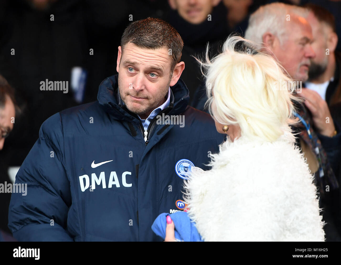 Peterborough United Chairman Darragh MacAnthony (left) in the stands ...