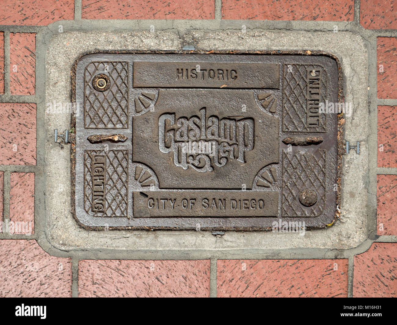 A Gaslamp Quarter Metal Utility Manhole Cover Electrical Lighting In ...