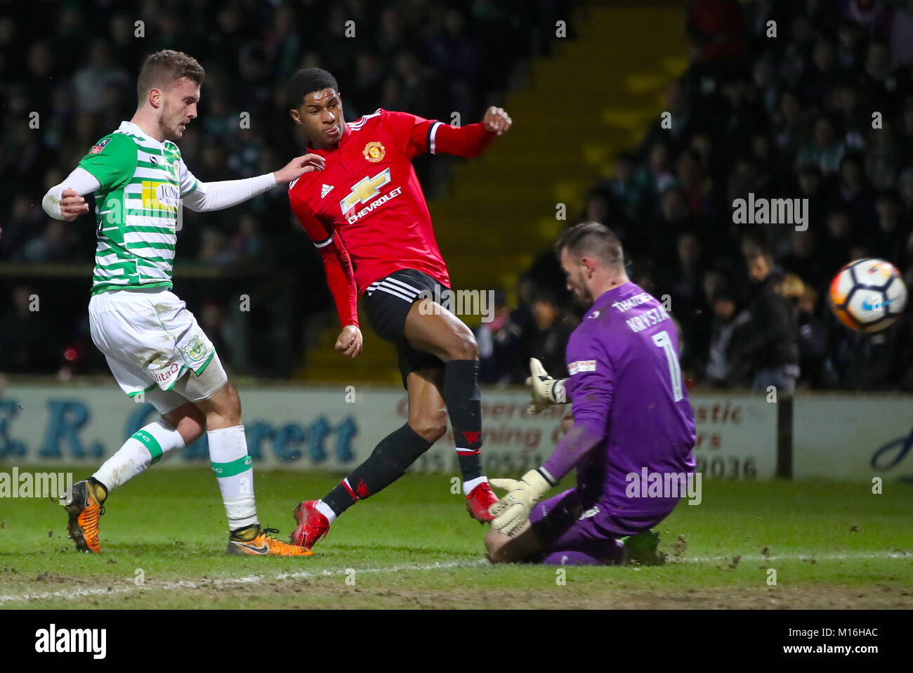 Manchester United's Marcus Rashford scores his side's first goal of the ...