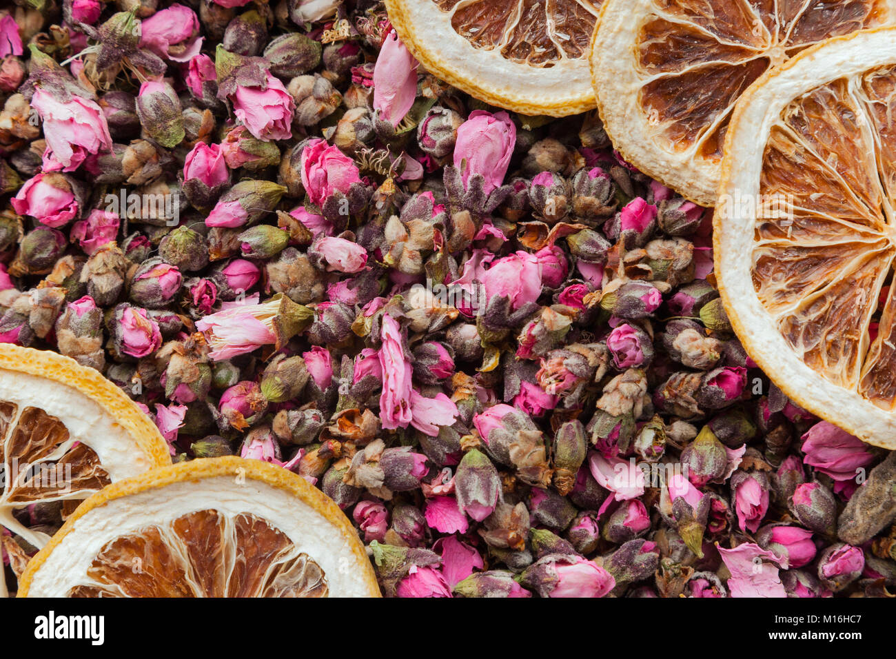 Tea flowers texture. Peach blossom tea with lemon. Organic dried flower ...