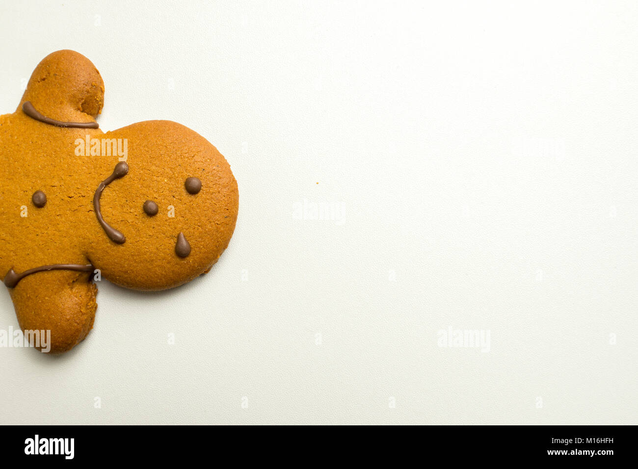 Home-Made Ginger Bread Man Cut In Half On A White Background Stock ...