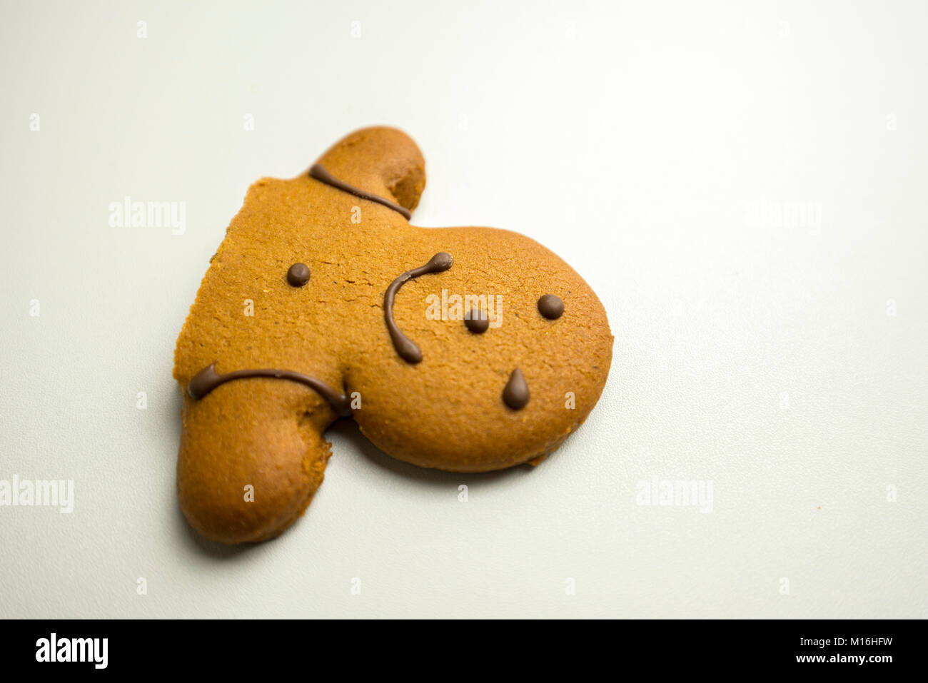 Home-Made Ginger Bread Man Cut In Half On A White Background Stock ...