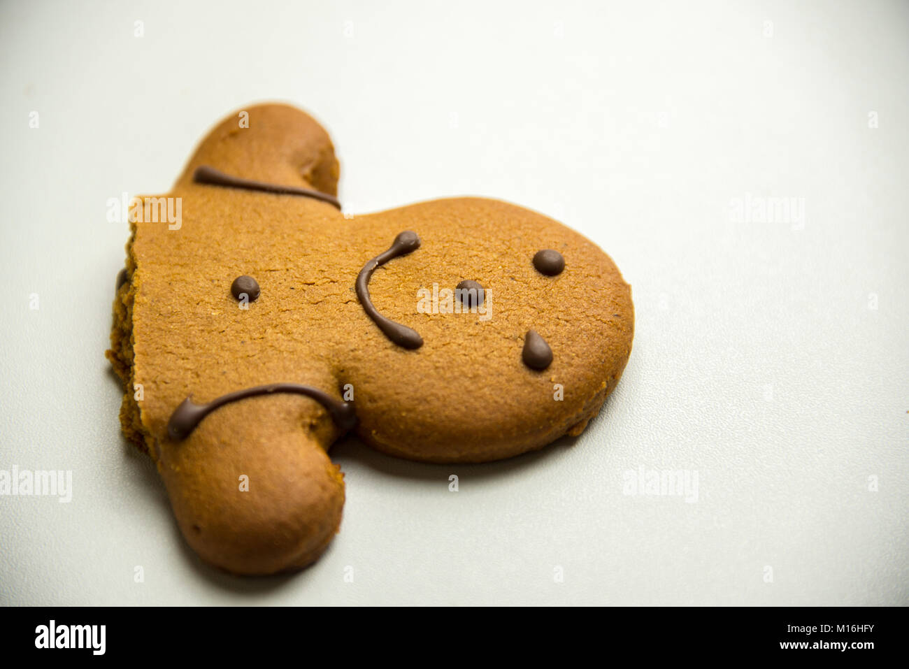 Home-Made Ginger Bread Man Cut In Half On A White Background Stock ...