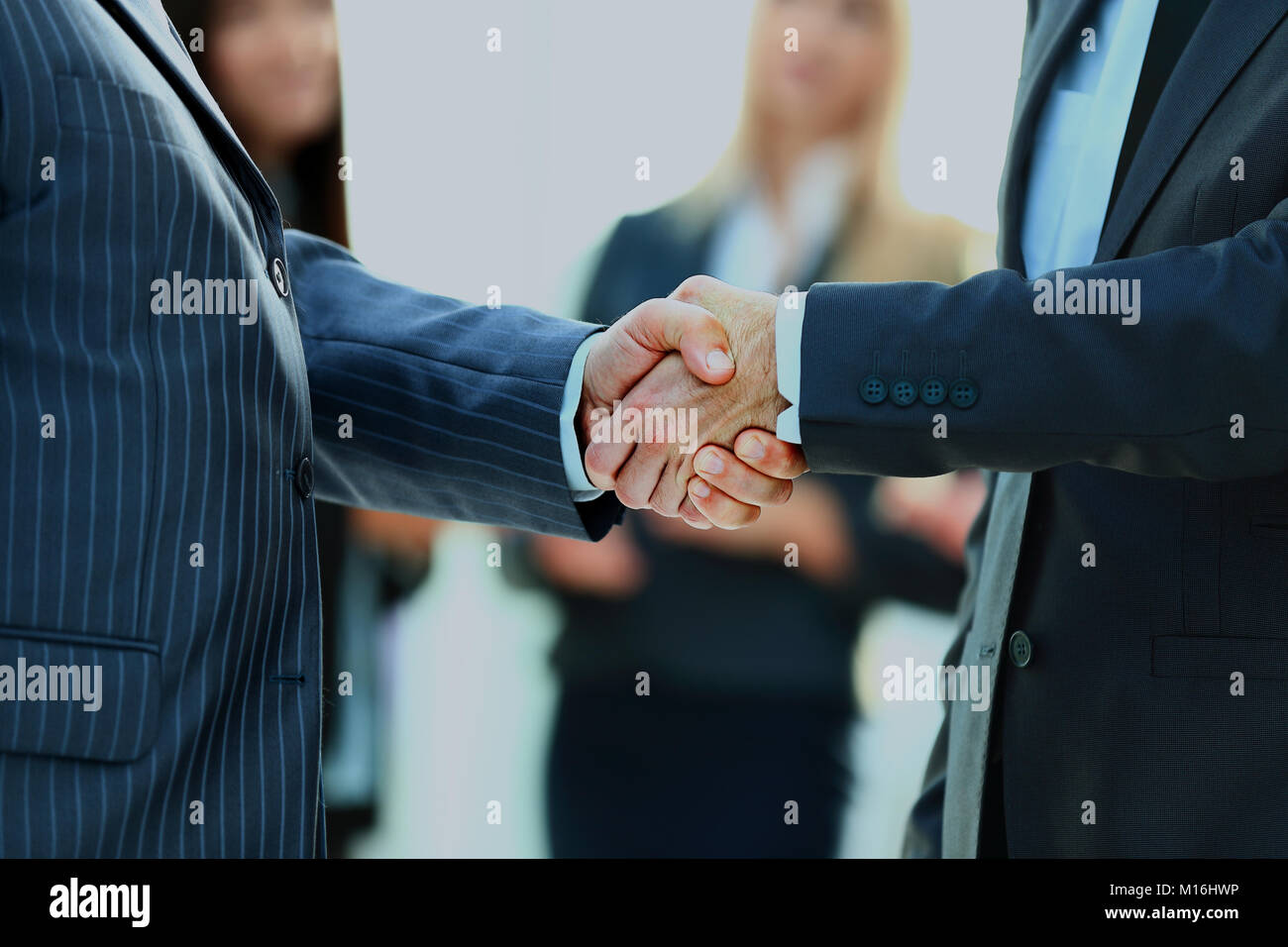 Business handshake. Business man giving a handshake to close the deal ...
