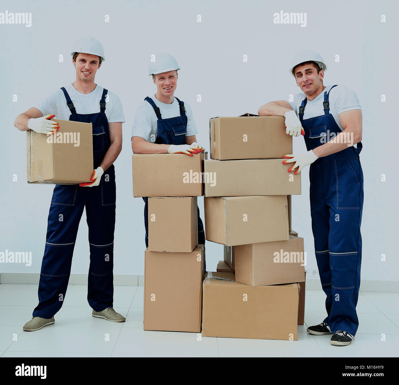 workers unload boxes Stock Photo - Alamy