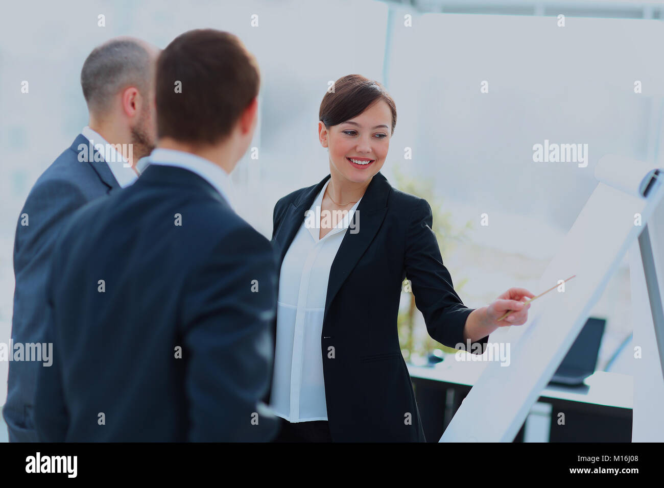 Portrait of executive businesswoman presenting his idea to his ...