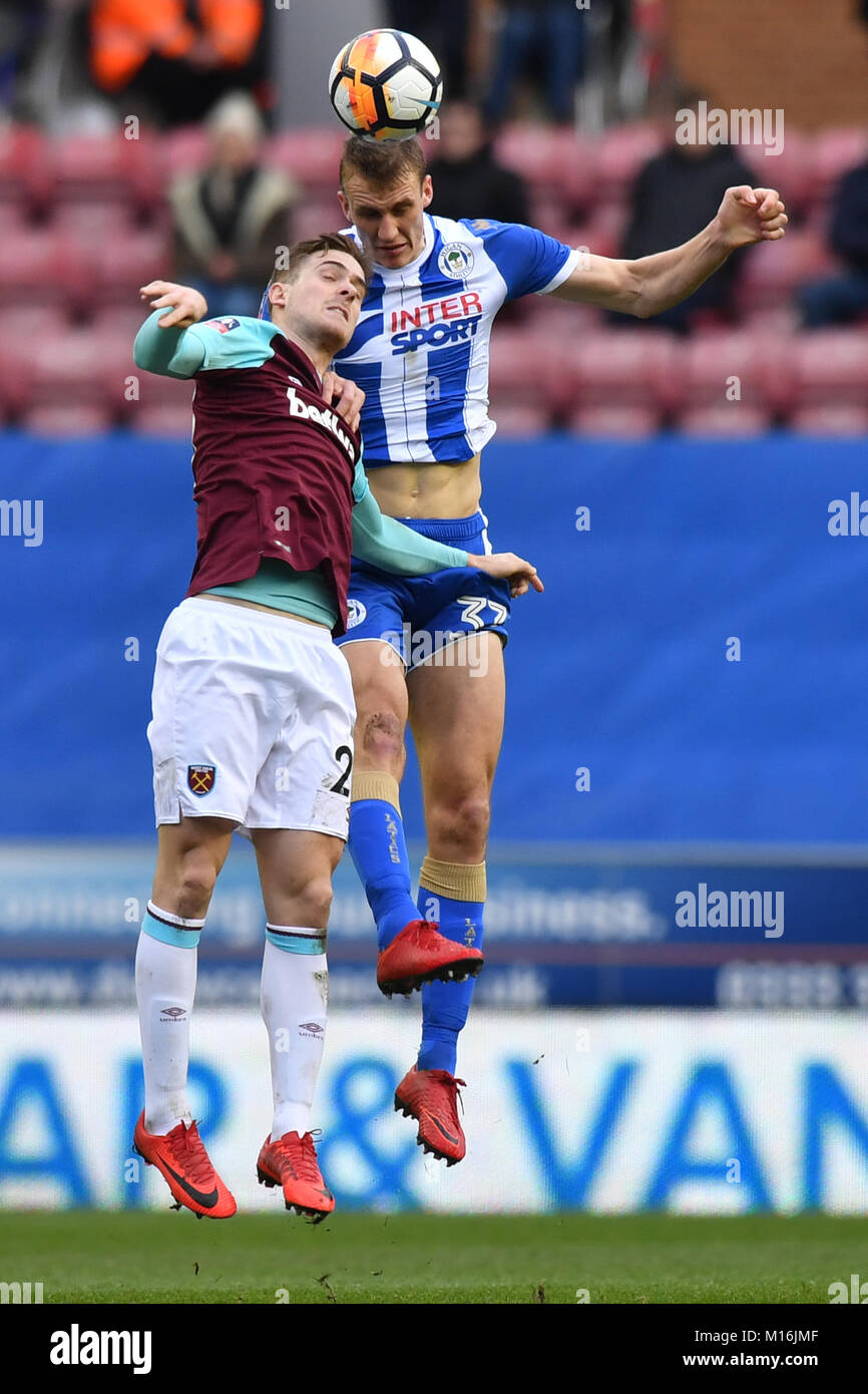 West Ham United's Reece Burke (left) and Wigan Athletic’s Dan Burn ...