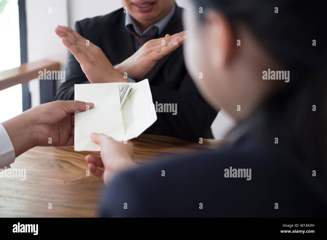 Businessman rejecting money cash banknote from business people. honest ...