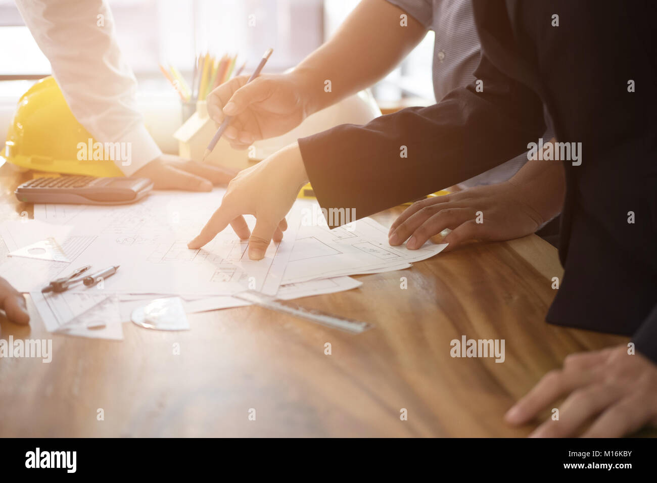 architect working on real estate project with partner at workplace ...