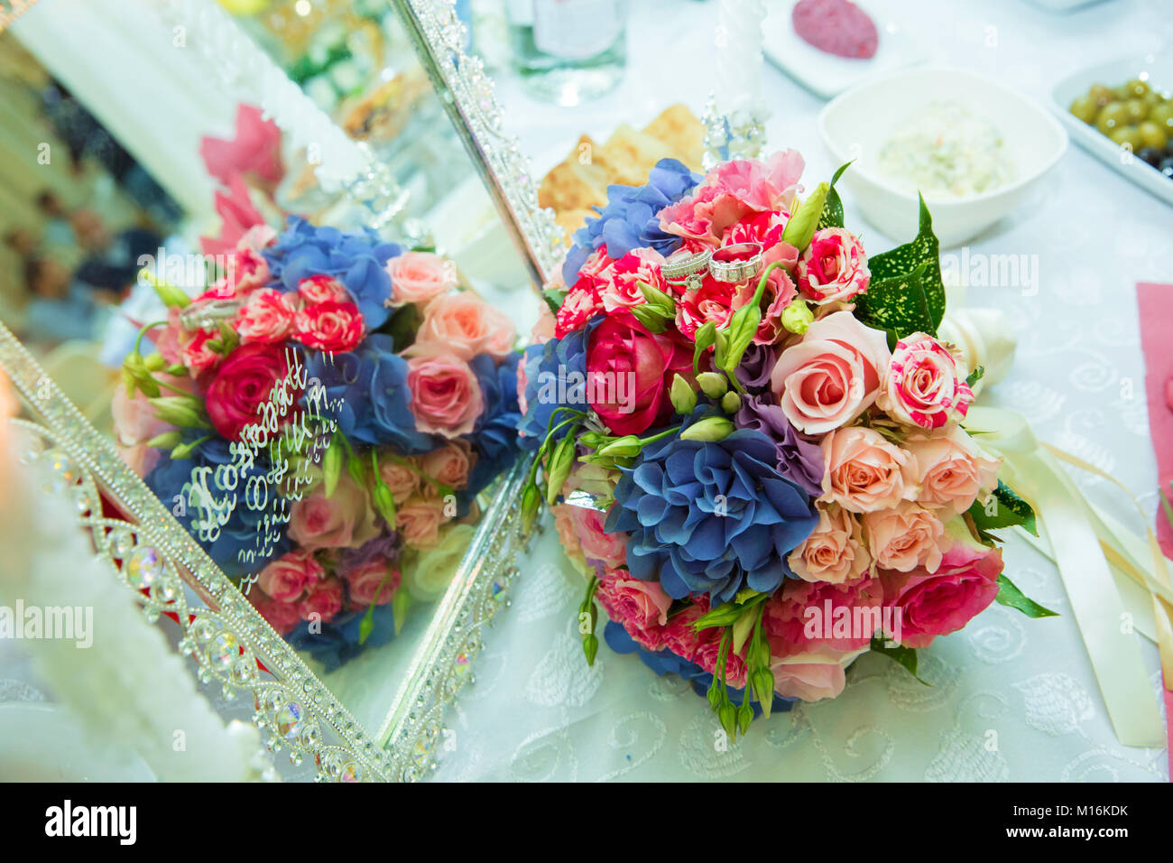 The multi-colored wedding bouquet blossoms in the mirror Stock Photo ...